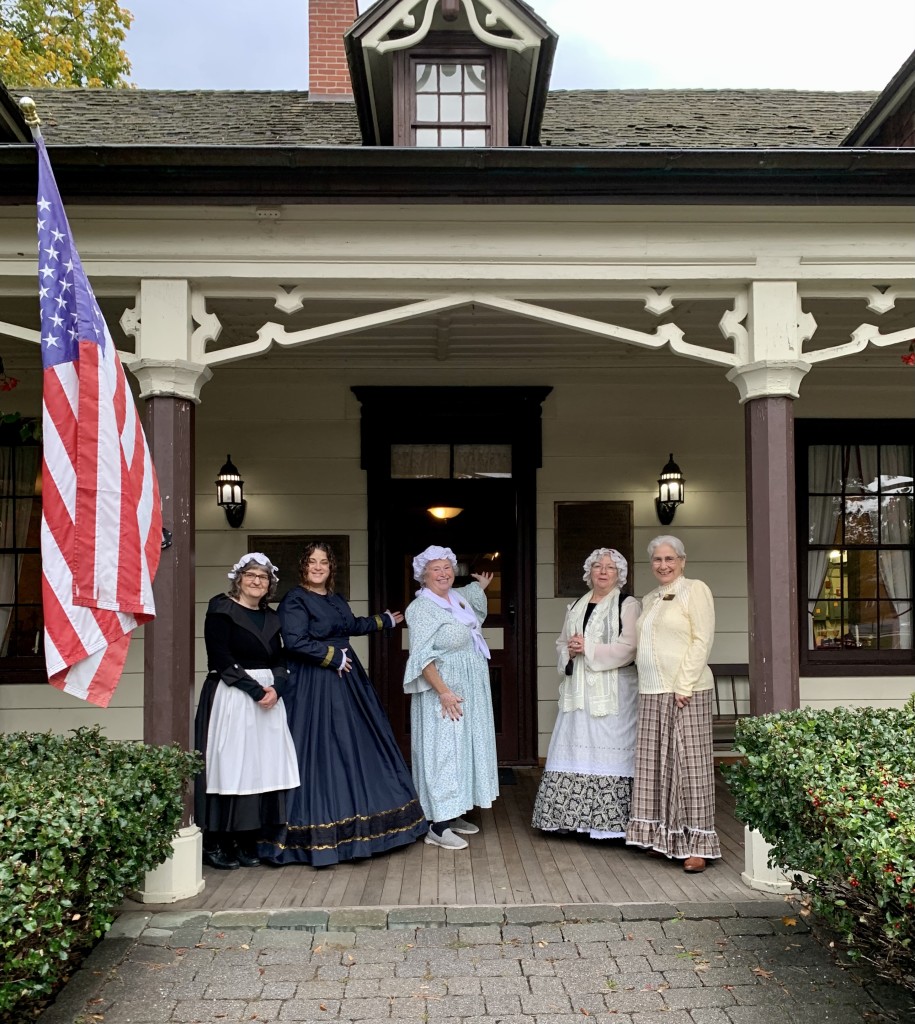 5 tour guides in Colonial and Victorian Costume welcome visitors to the ...